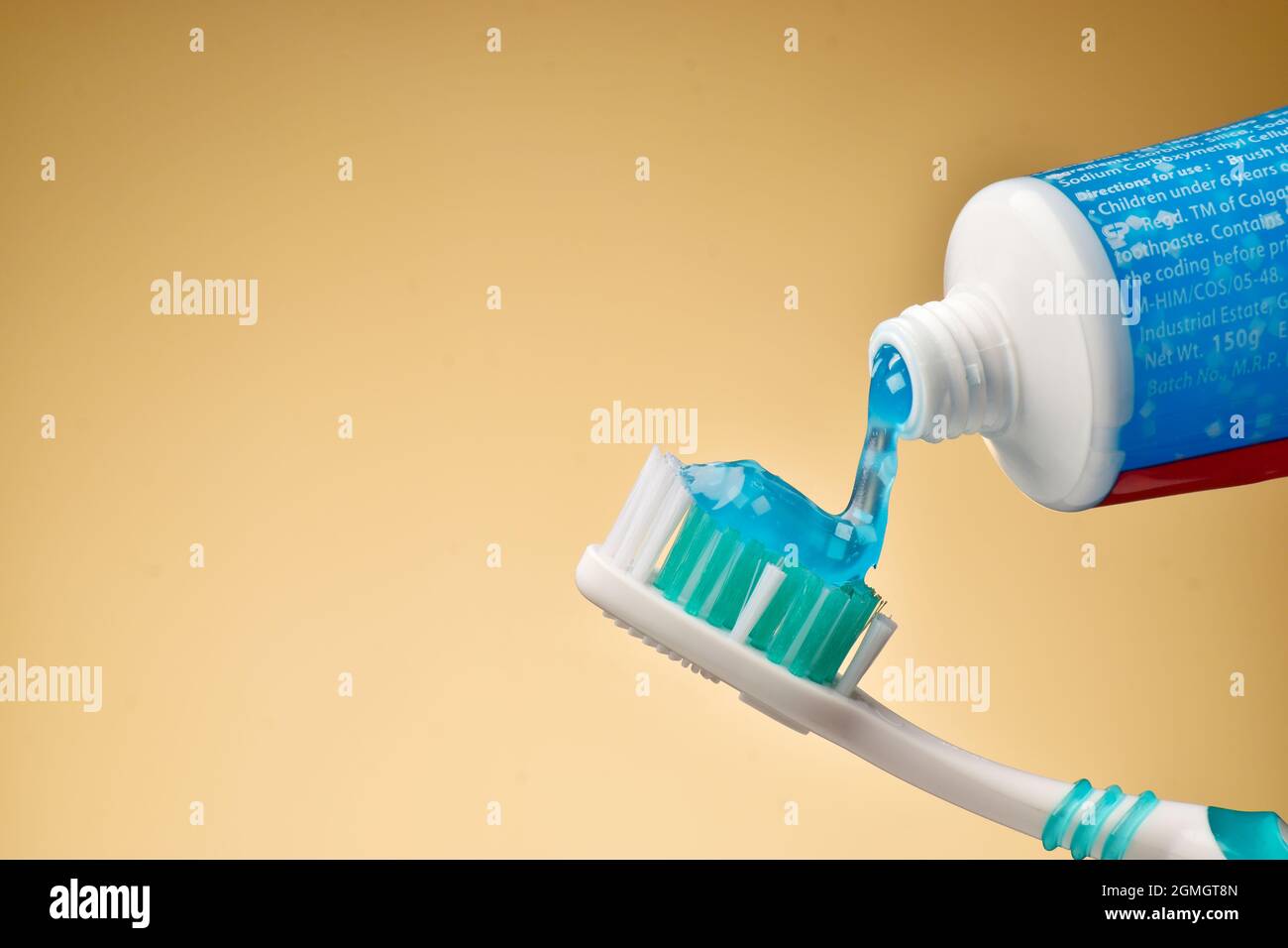 Applying Toothpaste on Brush Stock Photo - Alamy