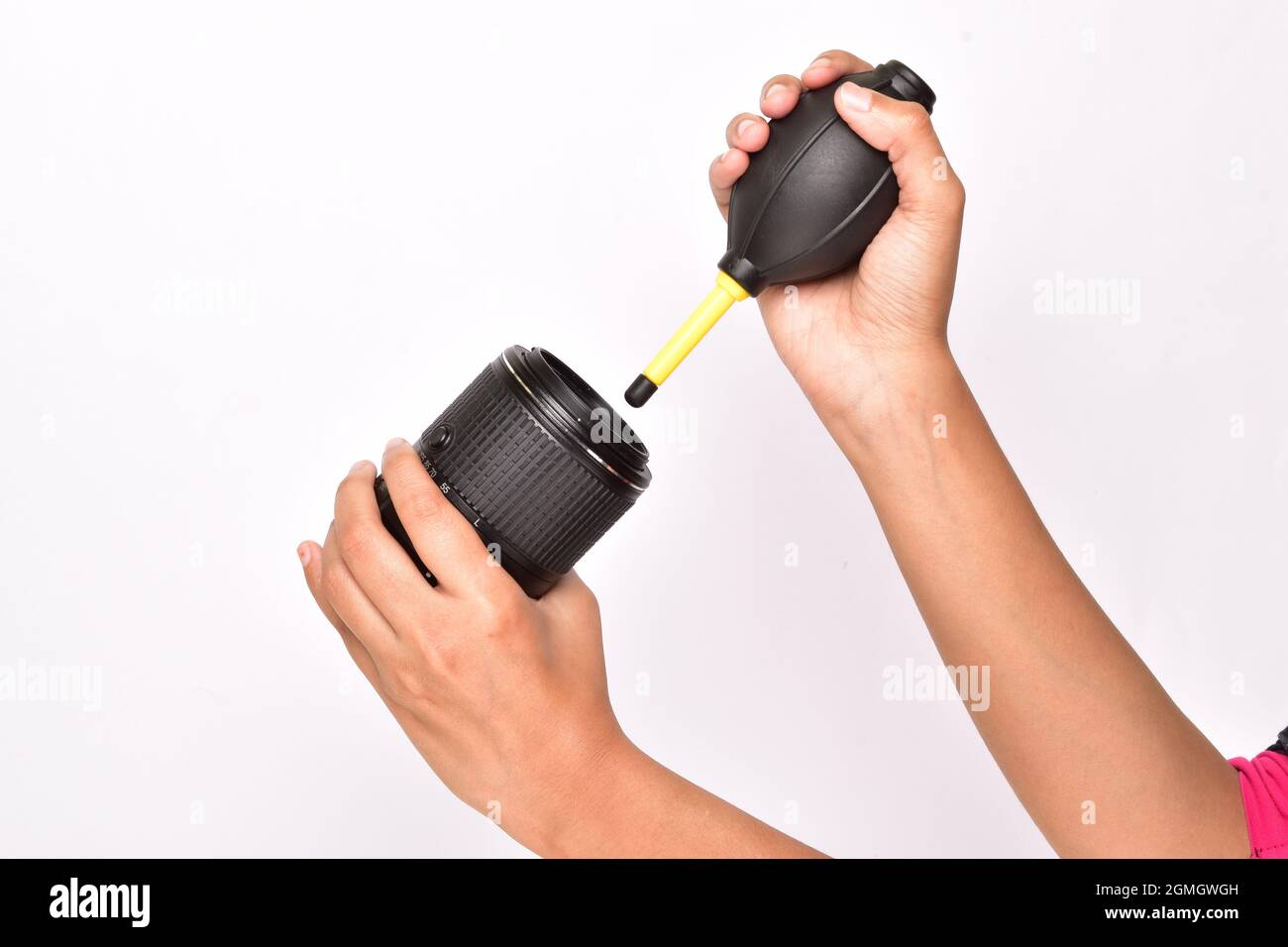 Cleaning Lens with the help of Air Blower Stock Photo - Alamy