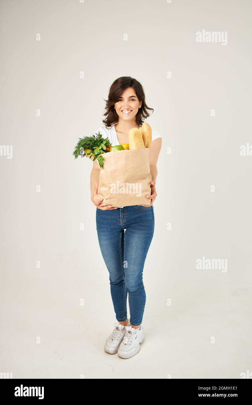 brunette with food package totally healthy food service Stock Photo - Alamy