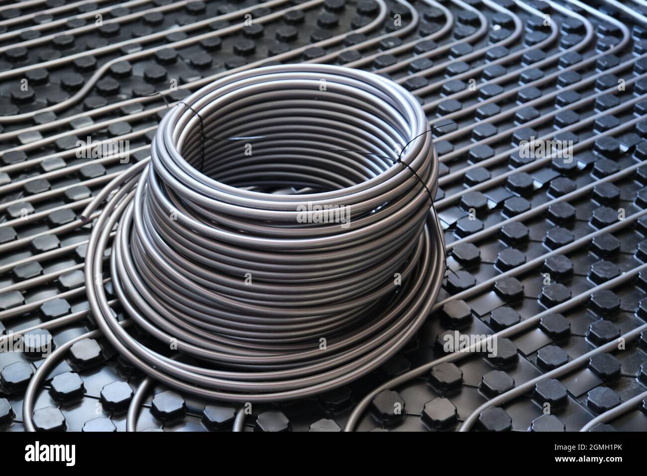 Underfloor surface heating and cooling pipes Stock Photo - Alamy