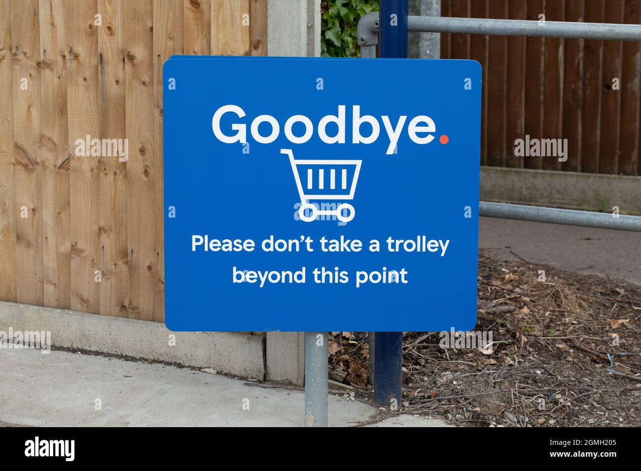 Sign, supermarket request, asking customers not to take trolley beyond ...