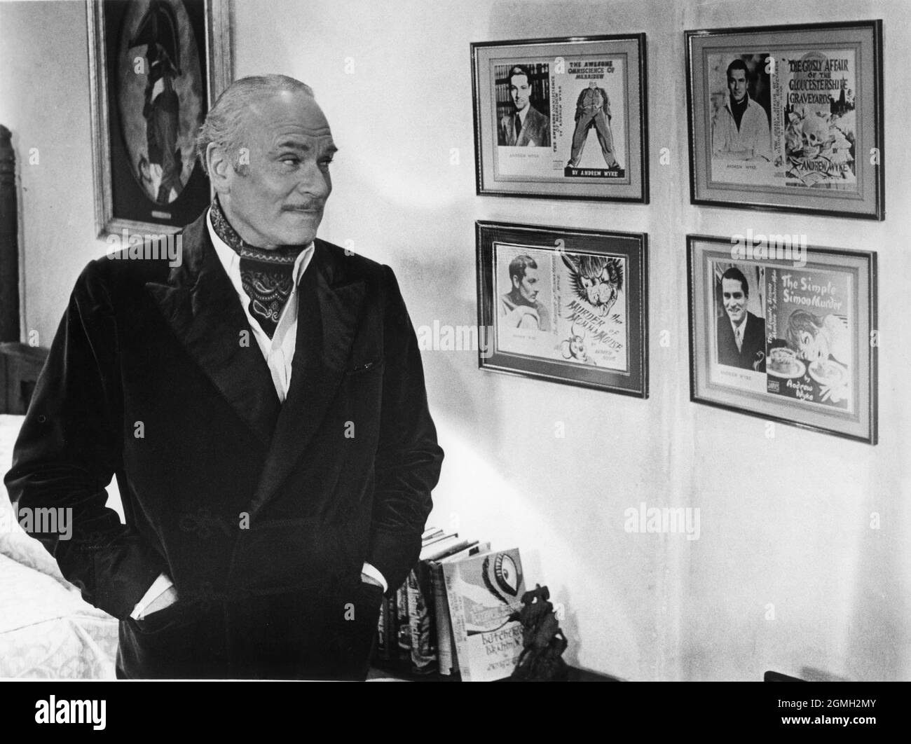 LAURENCE OLIVIER as author Andrew Wyke looks at his framed book jackets ...