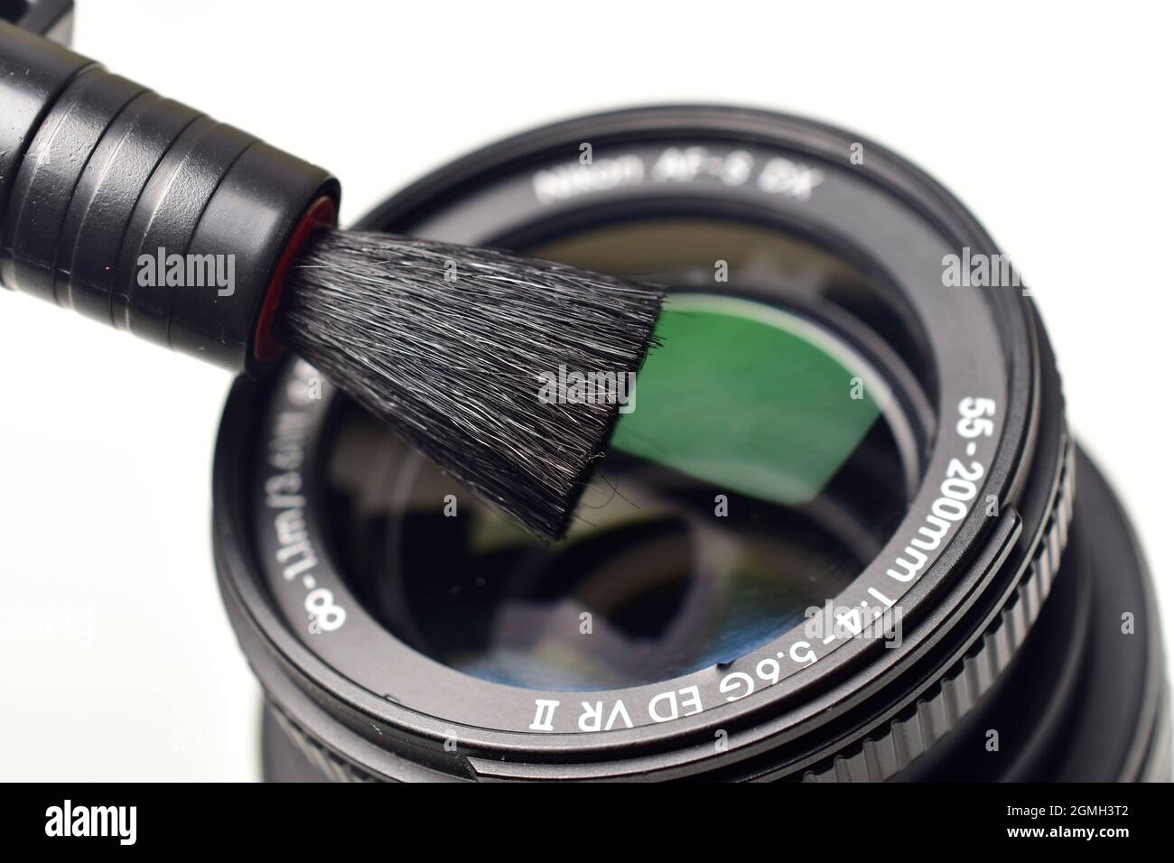 Cleaning Camera Lens with Brush and Removing Dust Stock Photo - Alamy