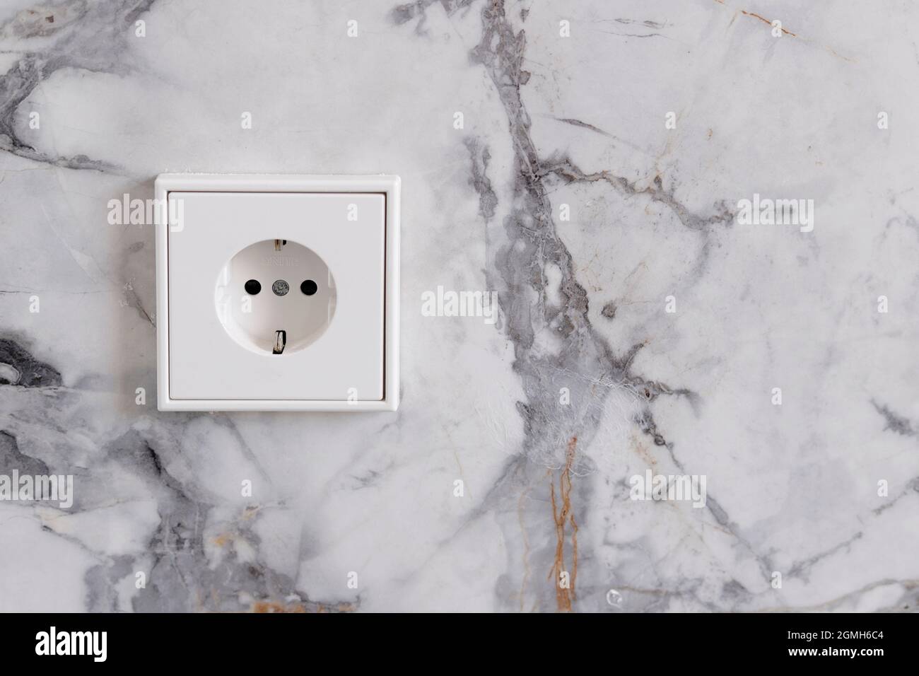 European socket seen from the front installed on marble Stock Photo - Alamy