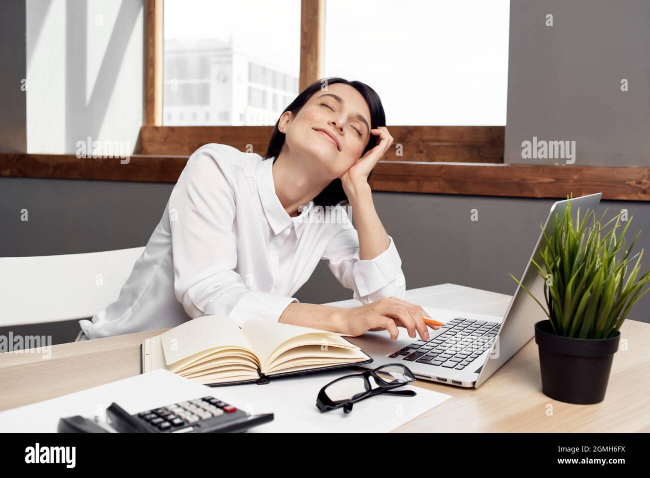 woman in costume in front of laptop Secretary executive Studio ...