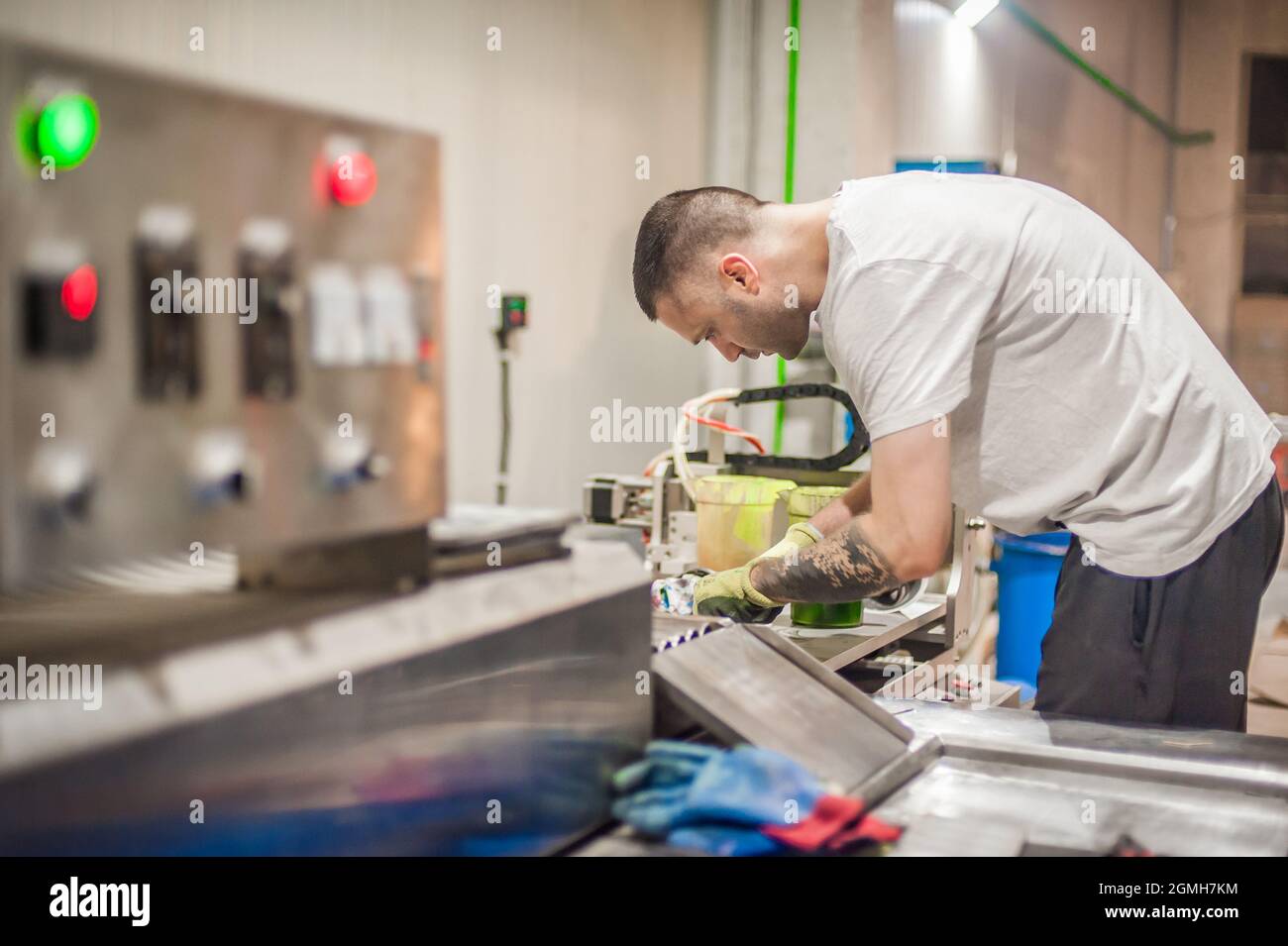 Professional worker technician machinist work in factory production ...