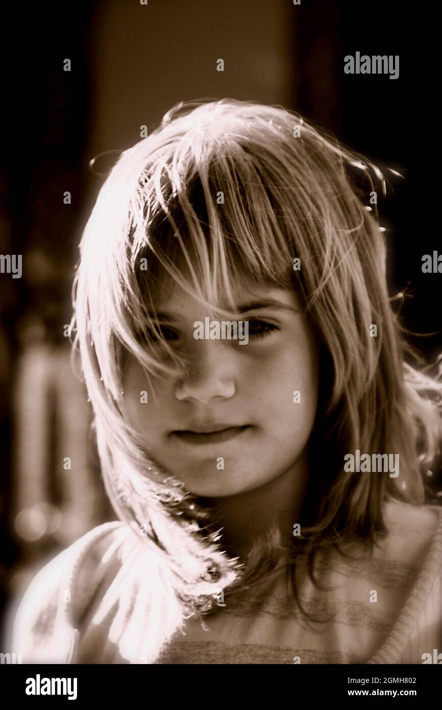 black and white photo of a blonde girl with wind in her face Stock ...