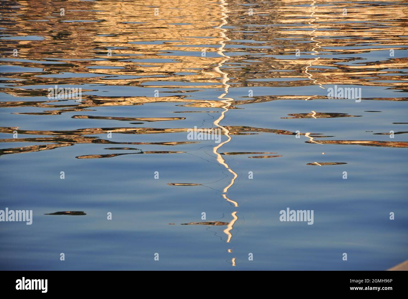 Abstract reflection of colorful Rijeka building on sea. Sea surface ...