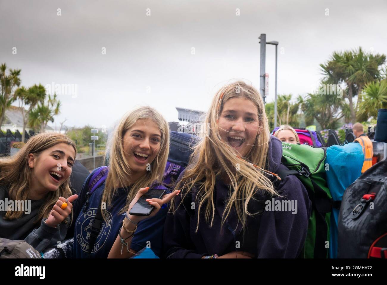 A group of excited young girls arriving at Newquay Train Station for ...