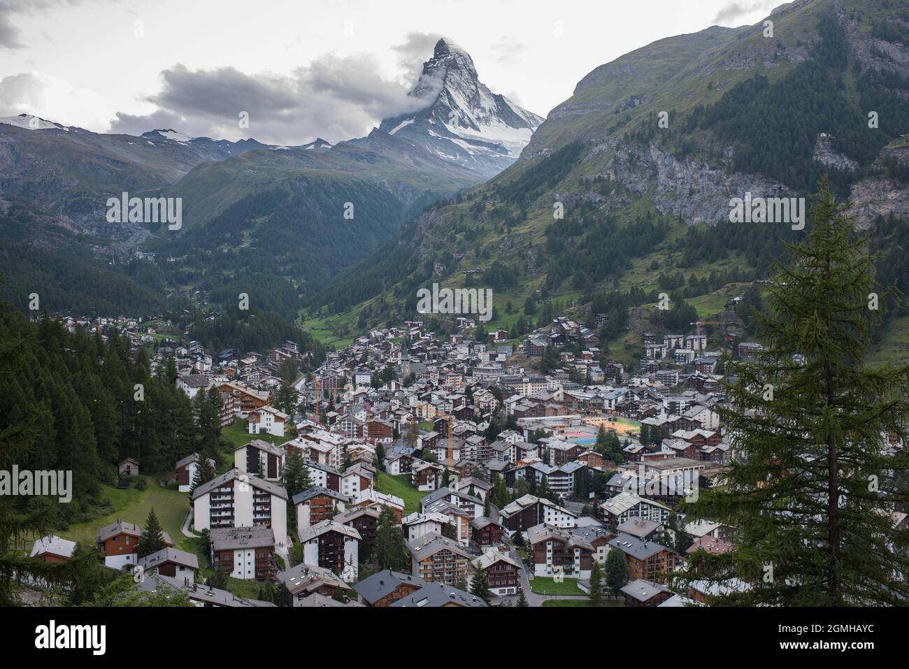 the famous village of zermatt in switzerland in the evening, with the ...