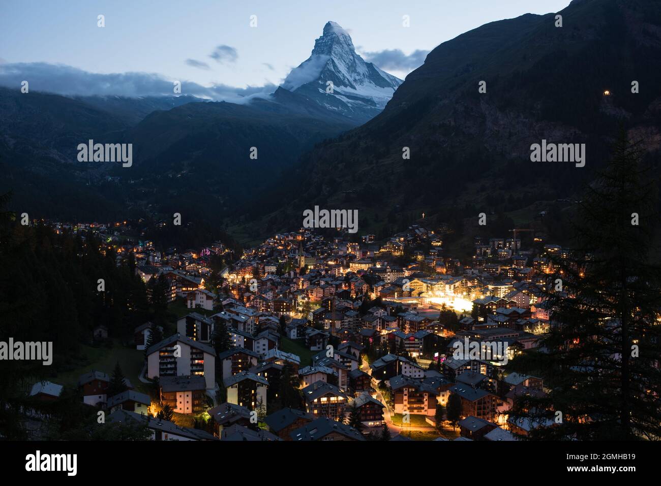 the famous village of zermatt in switzerland in the evening, with the ...