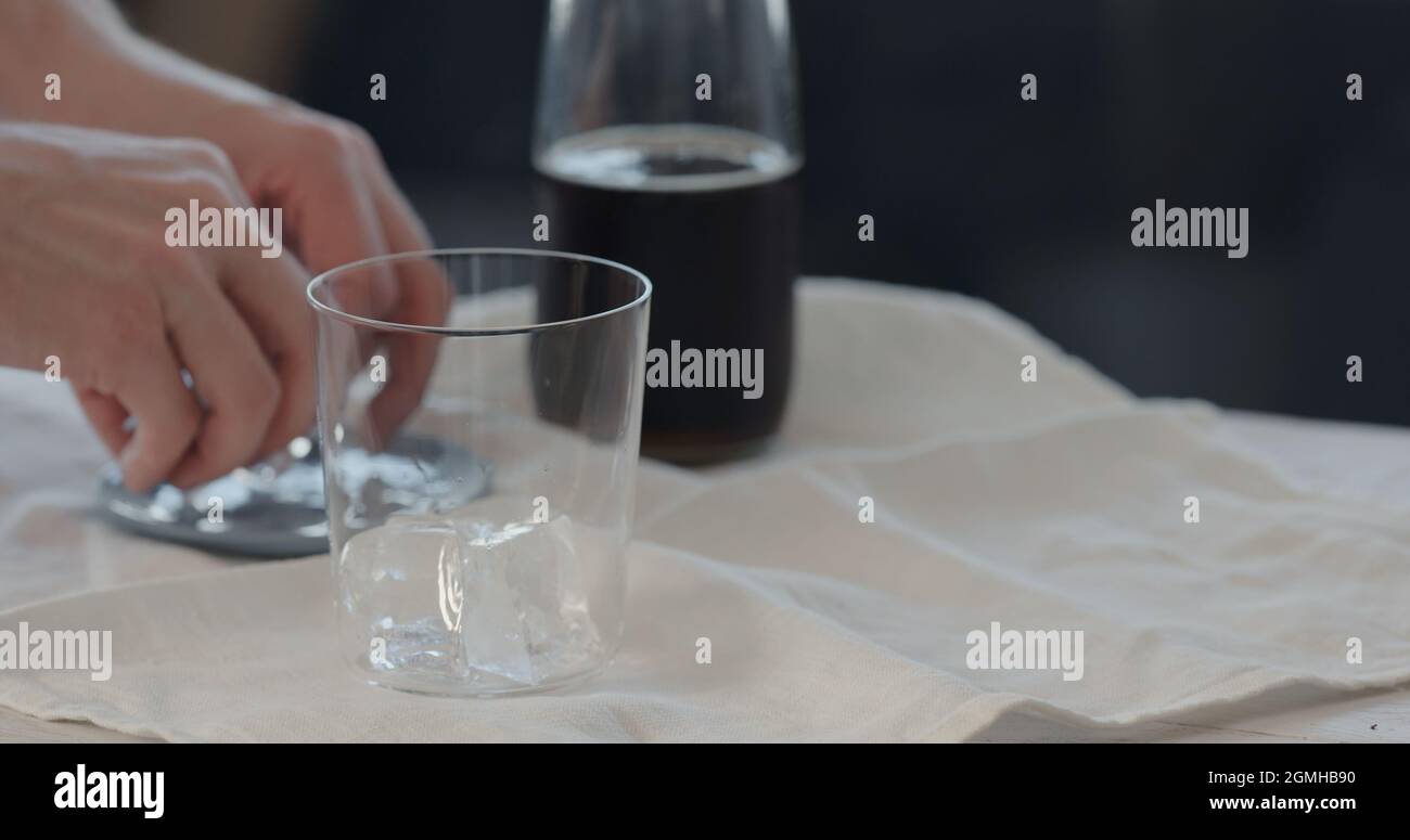Ice cube falling empty glass hi-res stock photography and images - Alamy