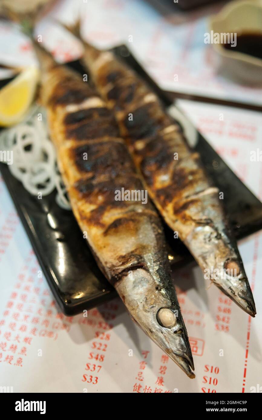 Grilled saury (fish) served in a Japanese restaurant in Yuen Long, New ...