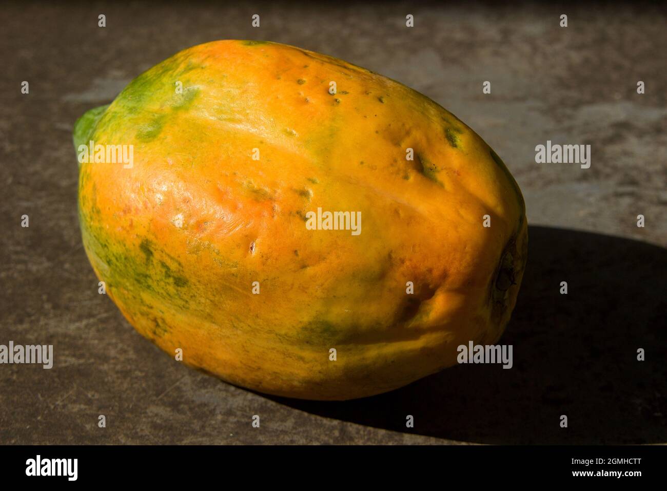 Close-up one ripe papaya fruit turned yellow in color Stock Photo - Alamy