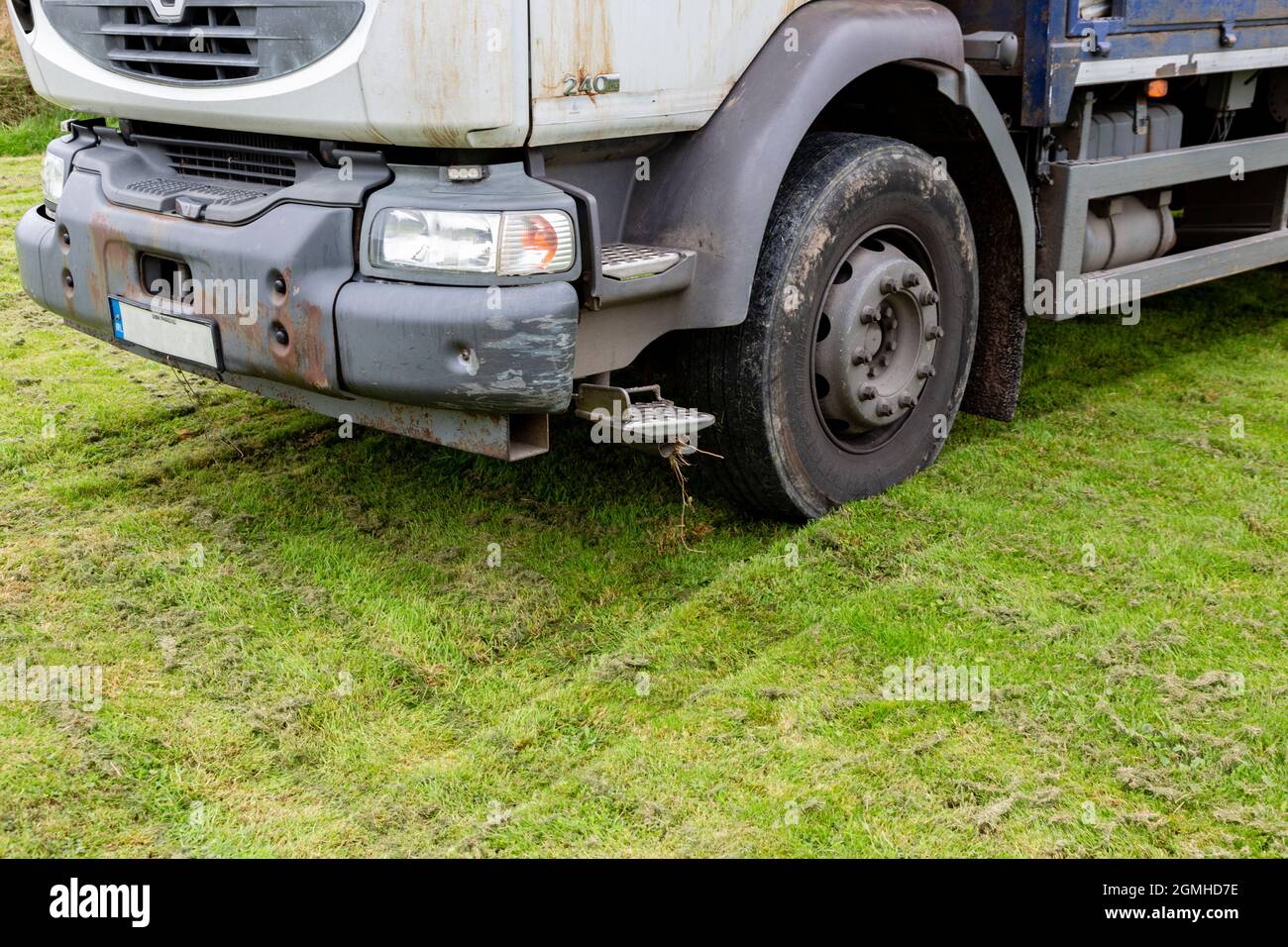 Tyre tracks from truck making ruts in garden lawn Stock Photo - Alamy