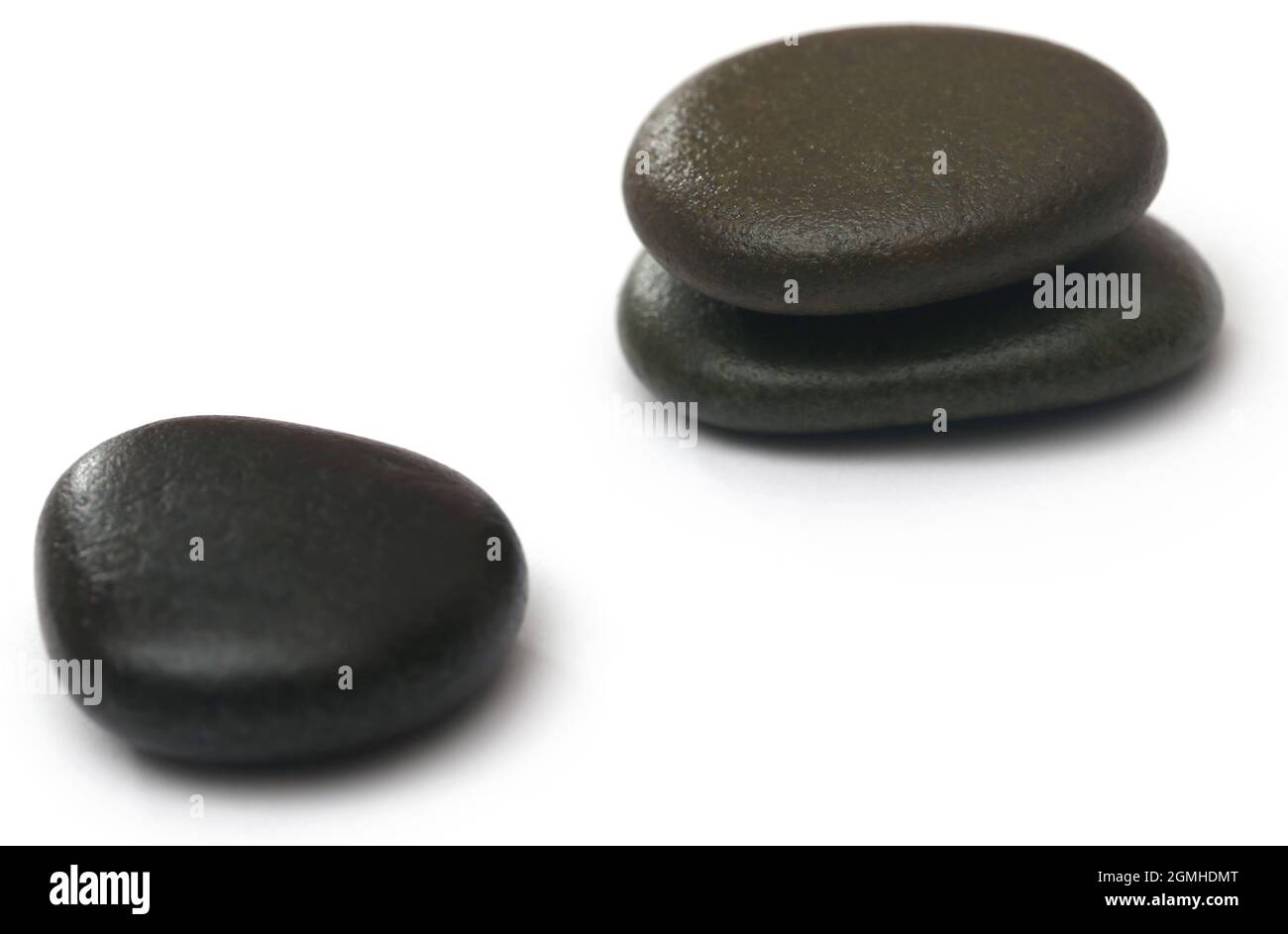 Massage stone isolated over white background Stock Photo - Alamy