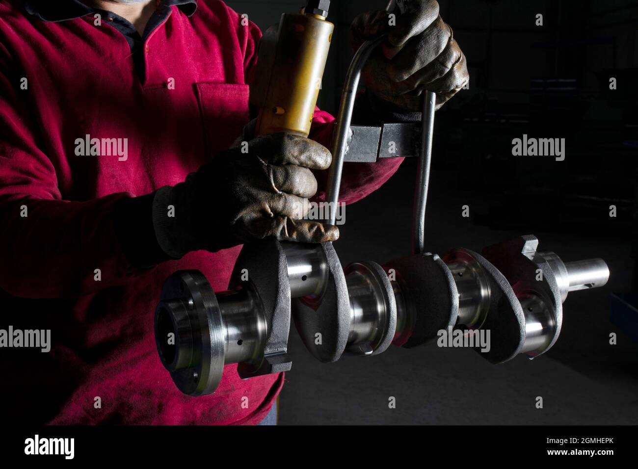 crankshaft in a worker's hand Stock Photo - Alamy
