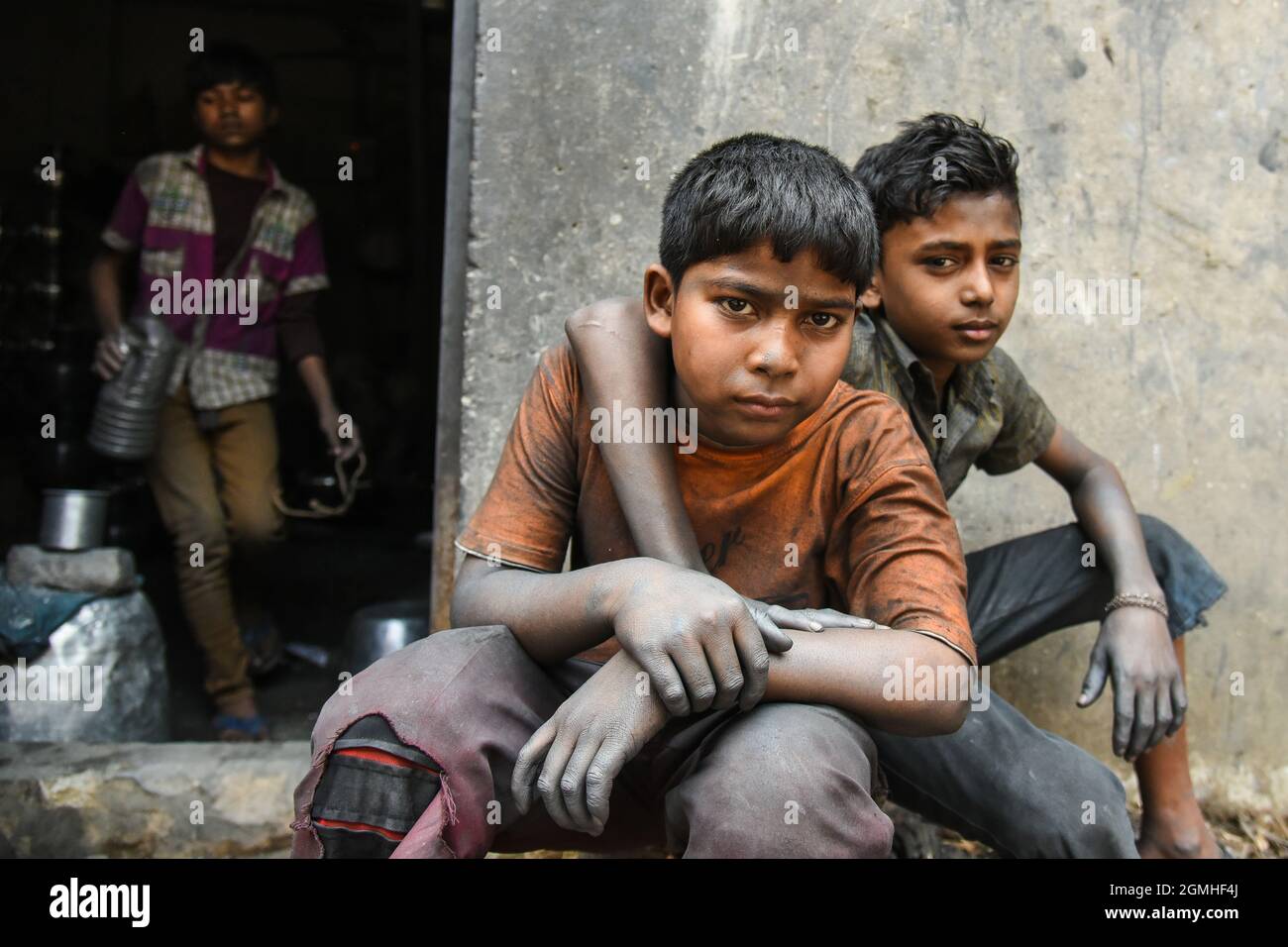 Two close friends sitting in front of an aluminum factory Stock Photo ...