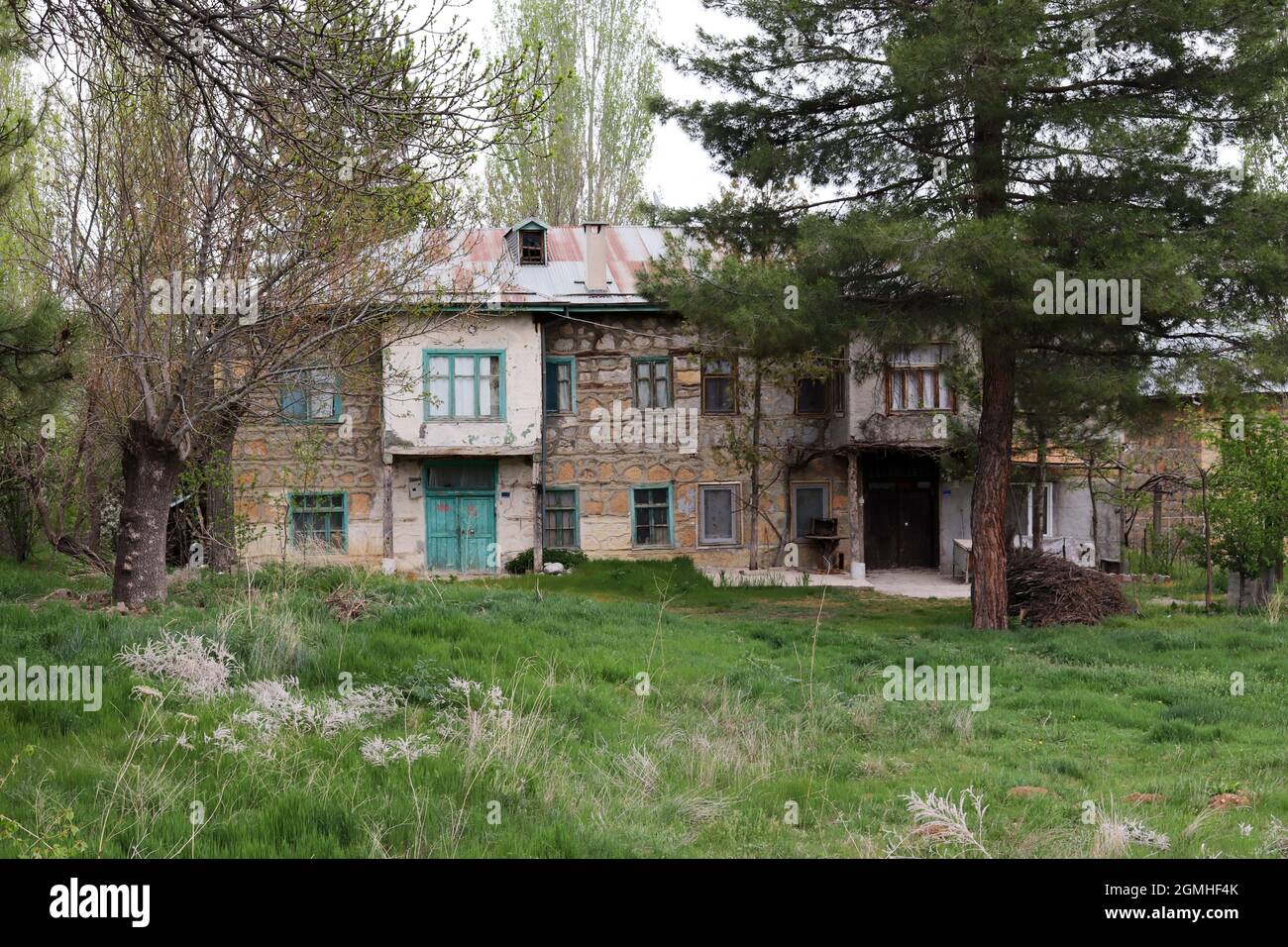 Traditional stone house and large garden Stock Photo - Alamy