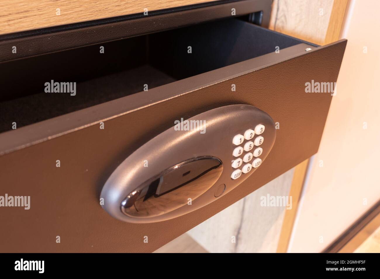 Open empty safe in hotel room or home. Safety box drawer with modern ...