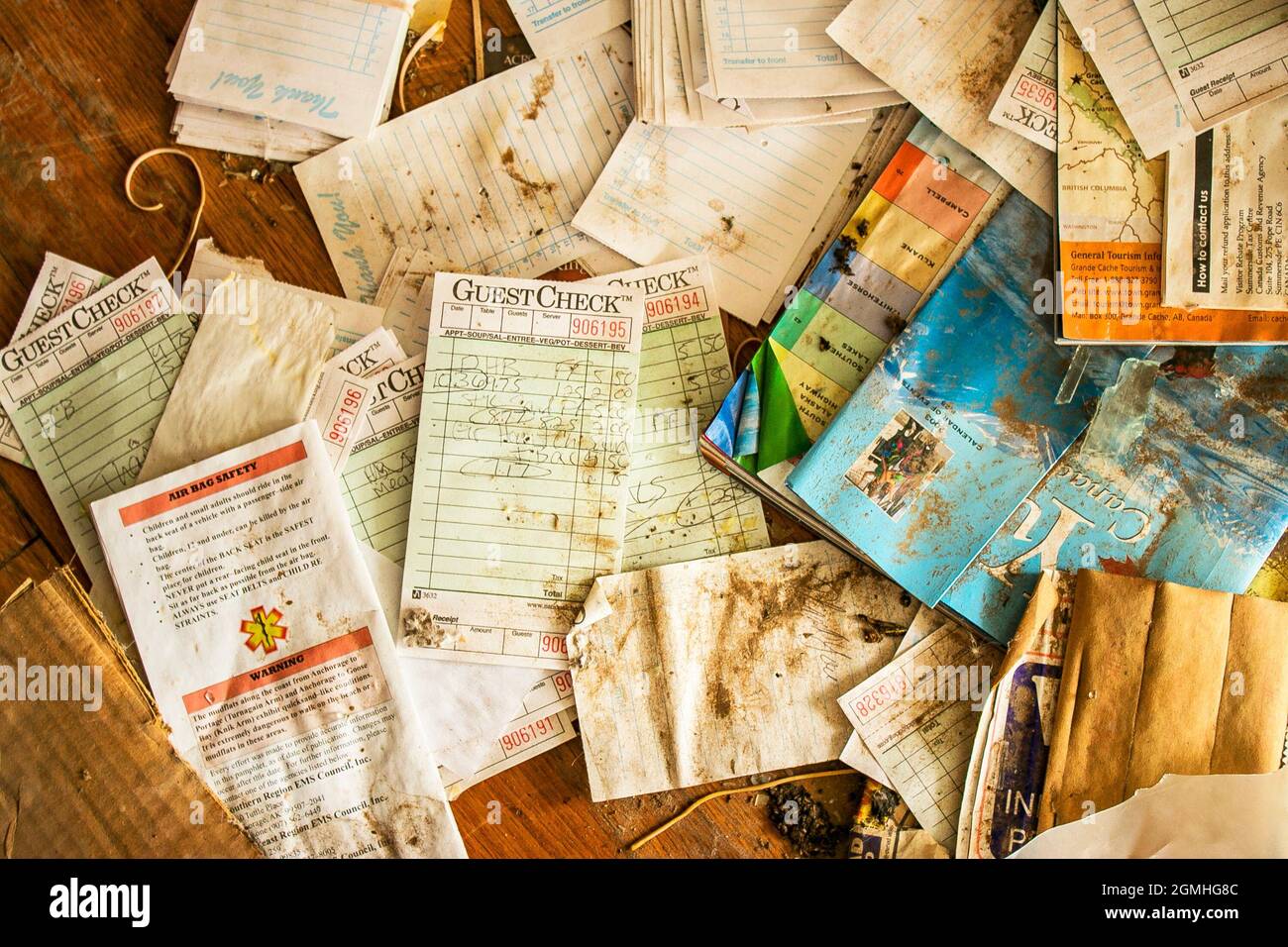 flat lay of guest check receipts on floor of abandoned derelict motel ...