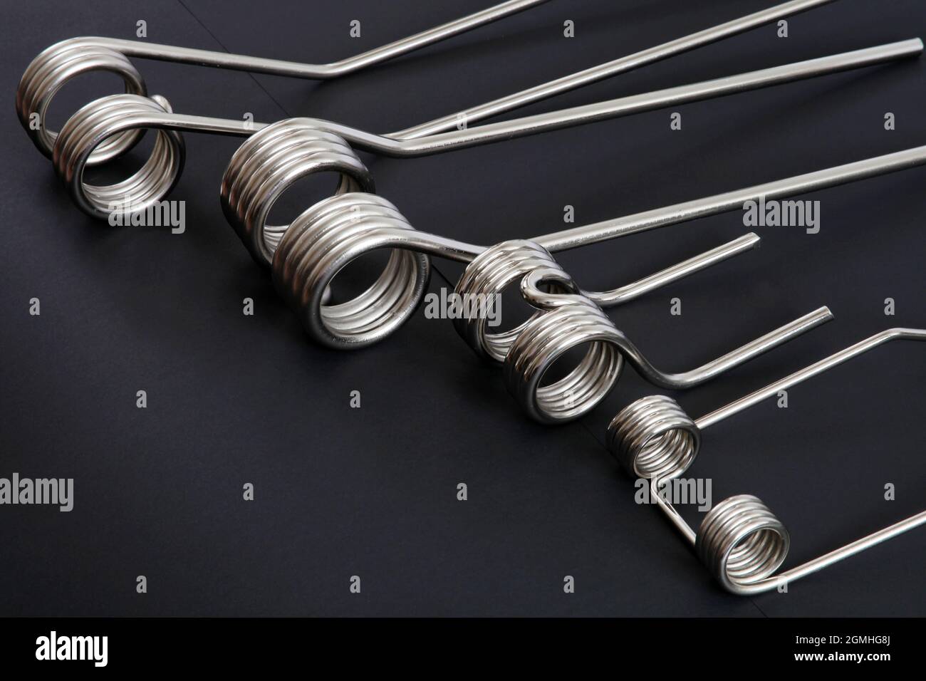 Metal springs in different sizes Stock Photo - Alamy