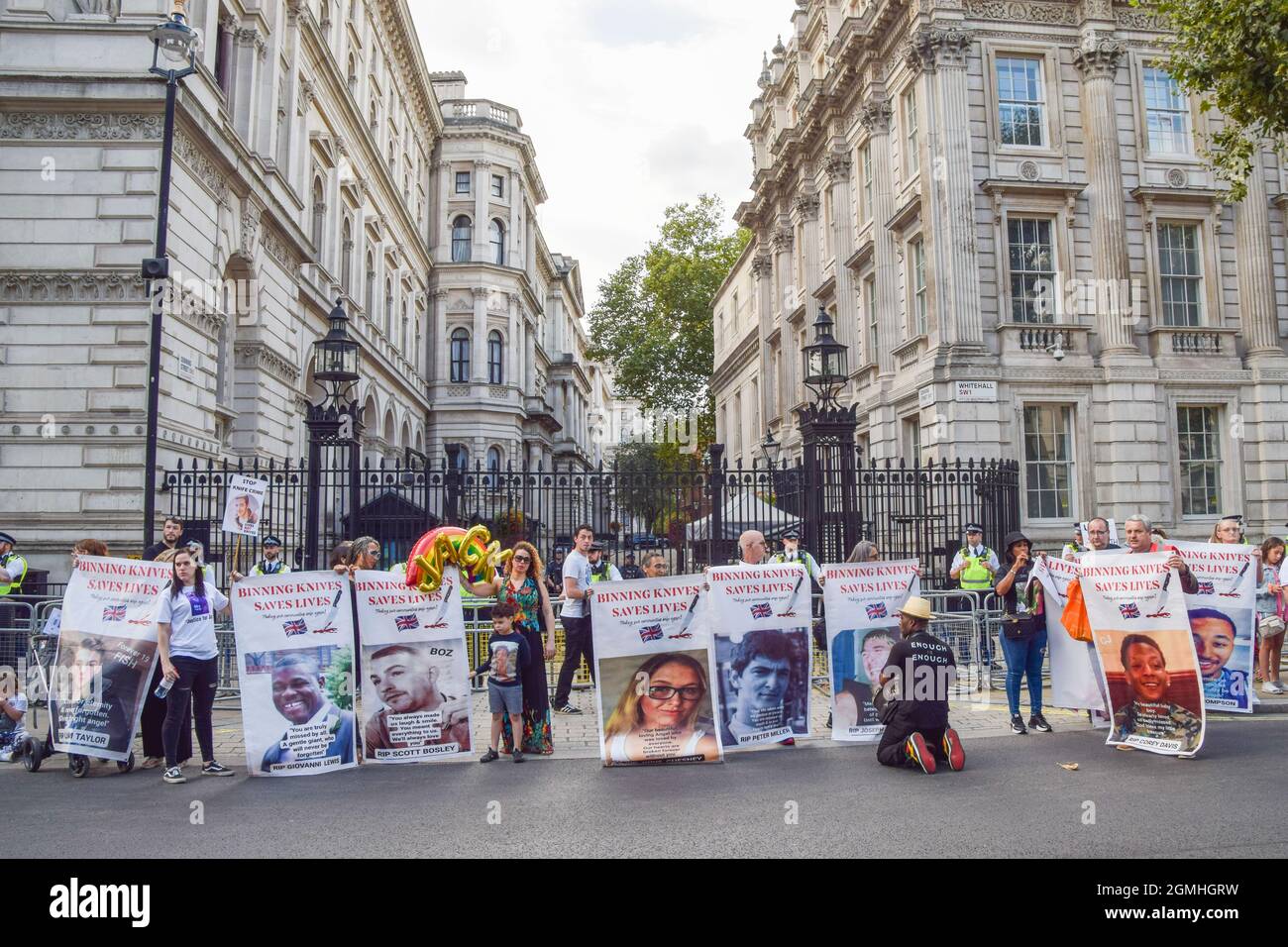 London, United Kingdom. 18th September 2021. Activists hold pictures of ...