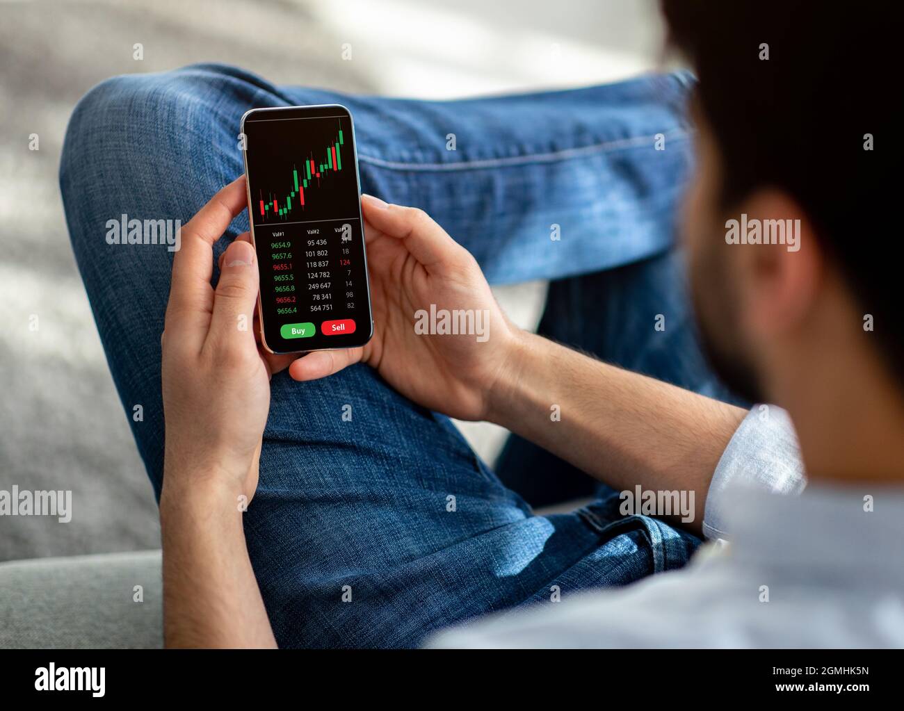 Arab guy using trading application on mobile phone, collage Stock Photo ...