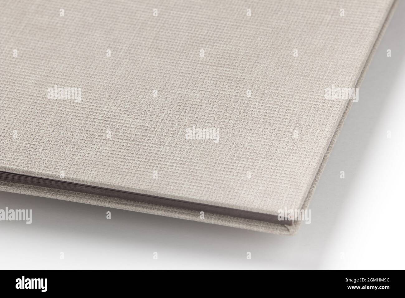 Grey hardcover book on white background Stock Photo - Alamy