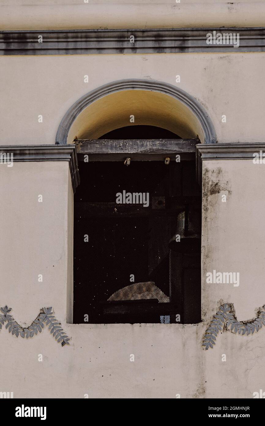 A vertical shot of a window on an old bell tower facade Stock Photo - Alamy