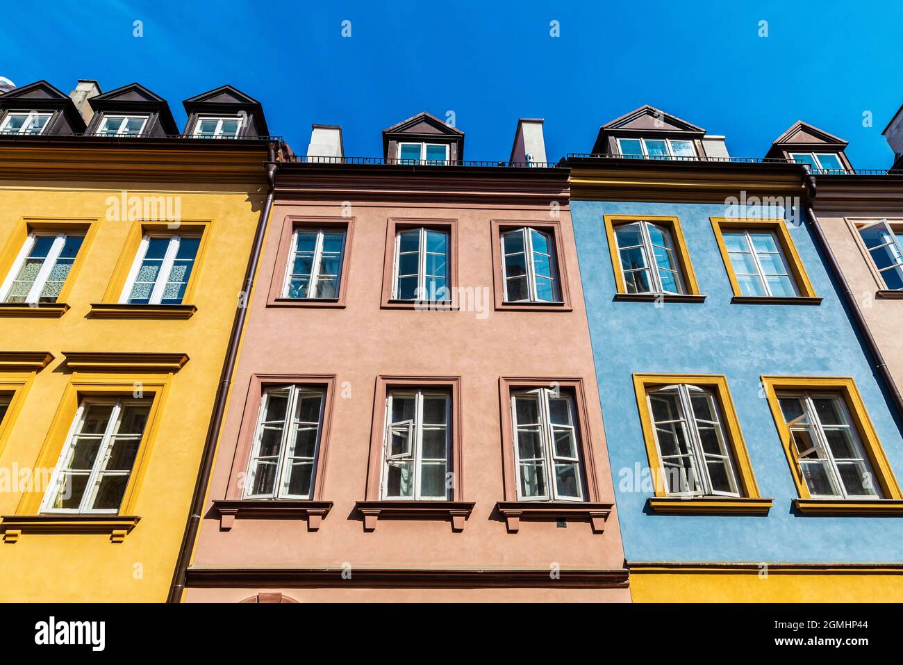 Facade of old classic multicolored buildings in the old town of Warsaw ...