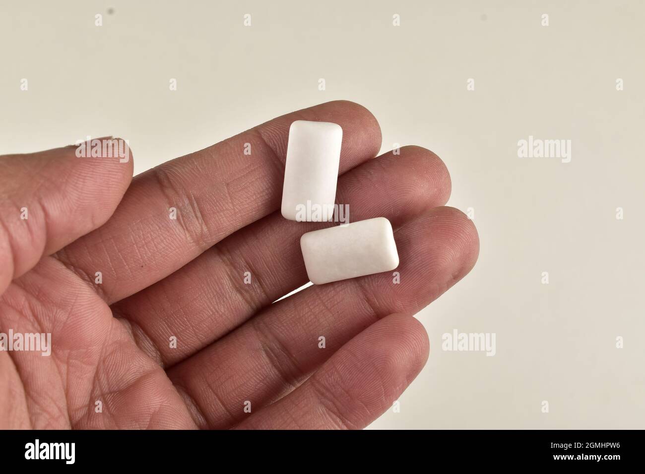 Mint Chewing Gum in Hand Stock Photo - Alamy