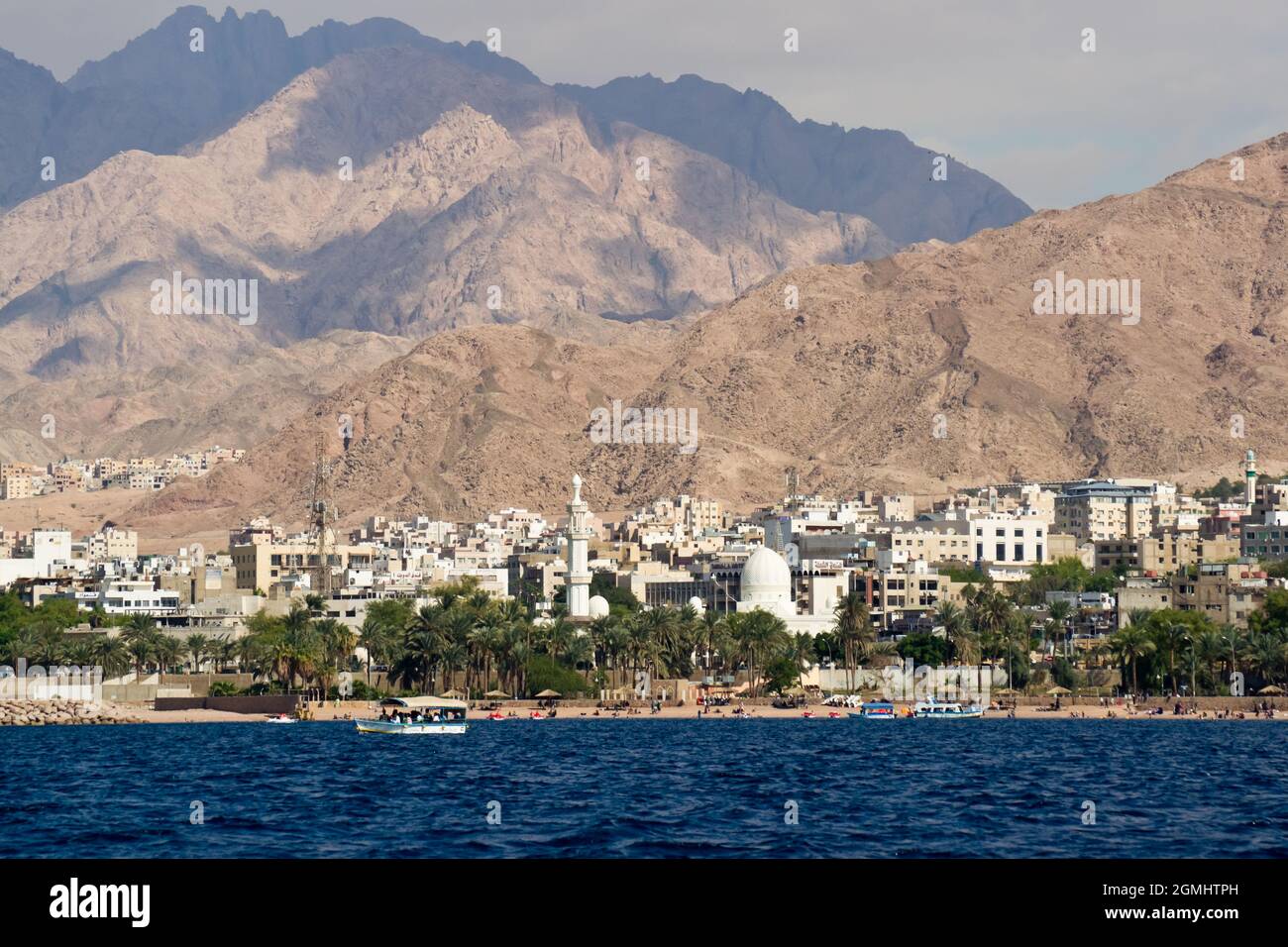 Seaside view of the jordan city of Aqaba at the Red Sea. Deep blue sea ...