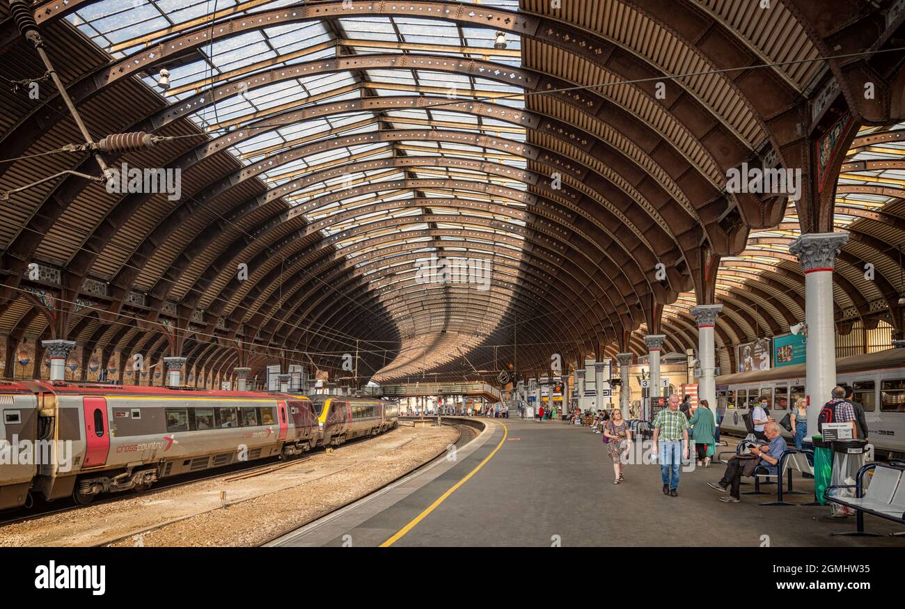A panorama of a railway station concourse. An 18th century iron canopy ...