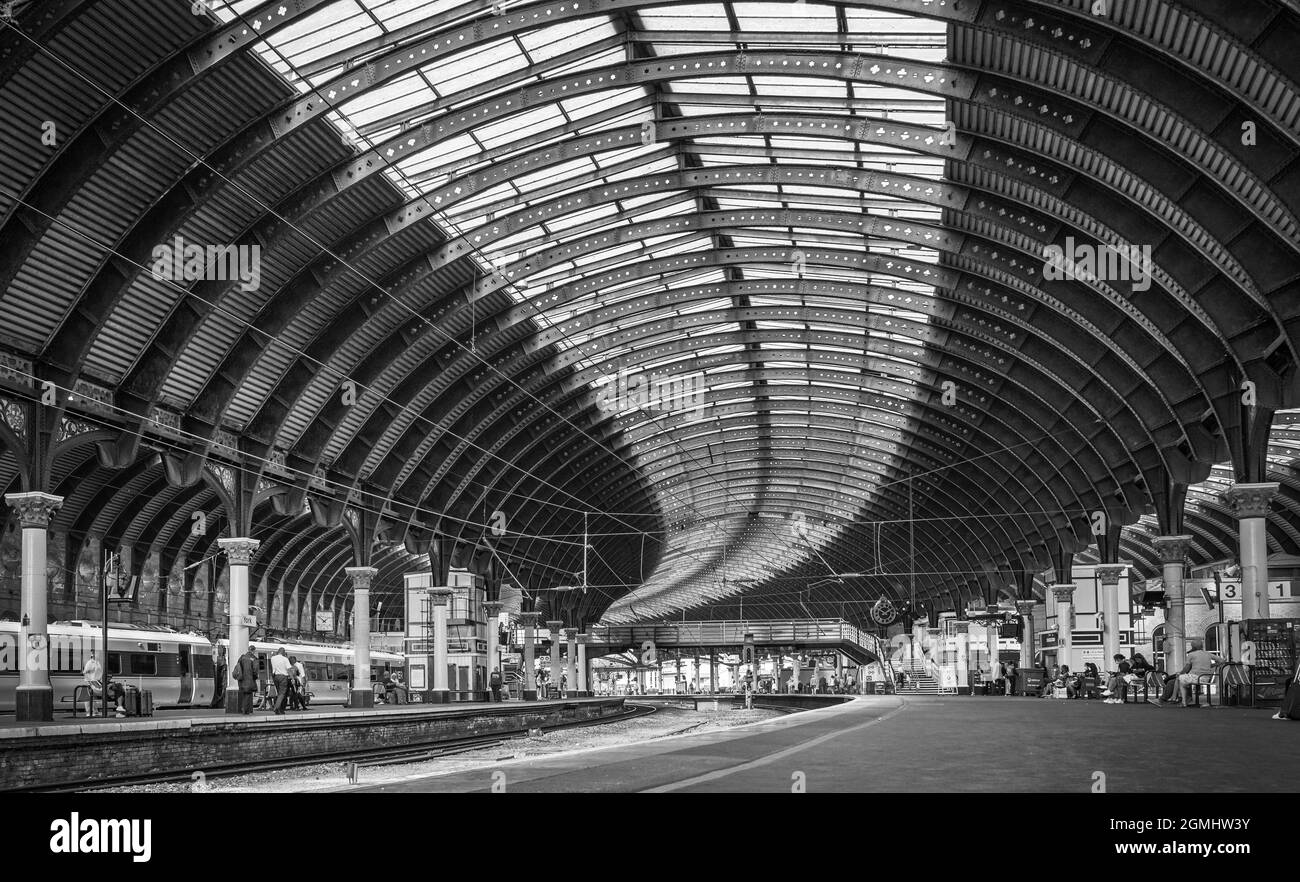 A panorama of a railway station concourse. An 18th century iron canopy ...