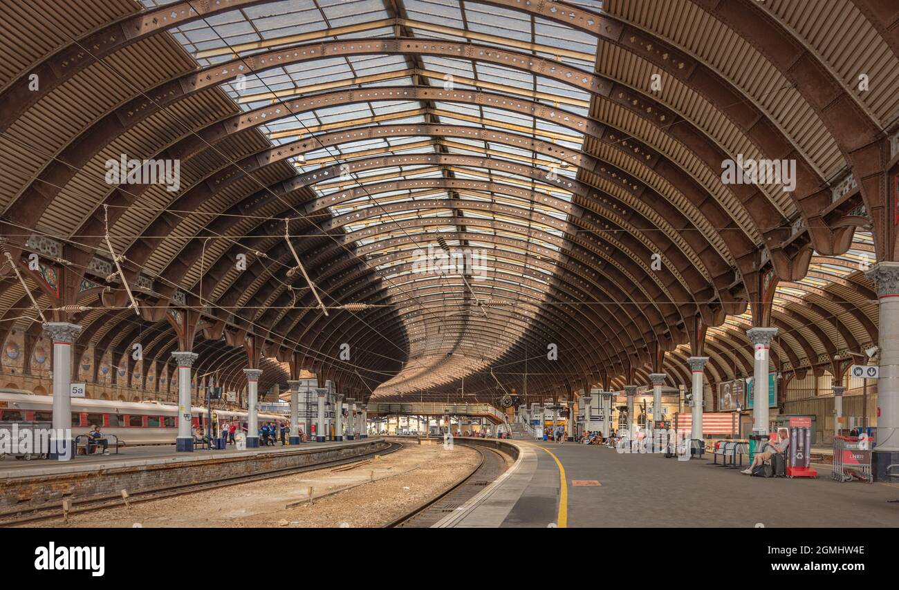 A panorama of a railway station concourse. An 18th century iron canopy ...