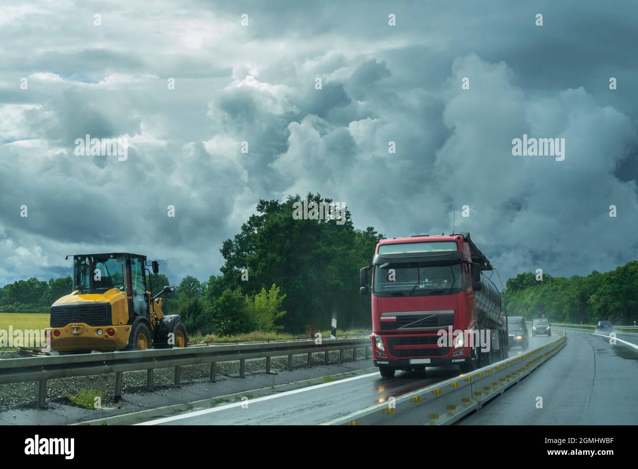 Heavy rain clouds over a German highway Stock Photo - Alamy