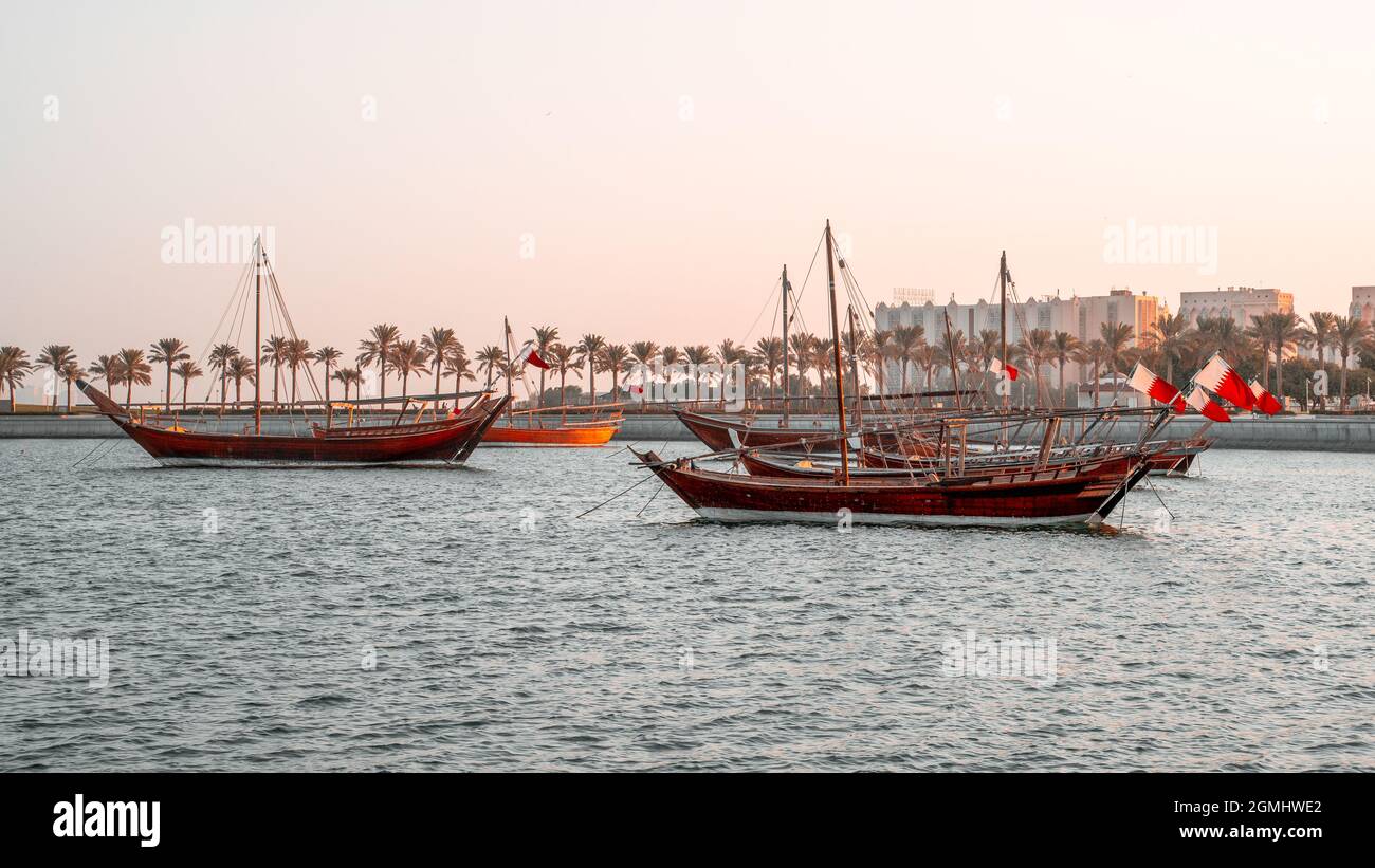 Qatar skyline along with a qatar traditional dhow. selective focus ...