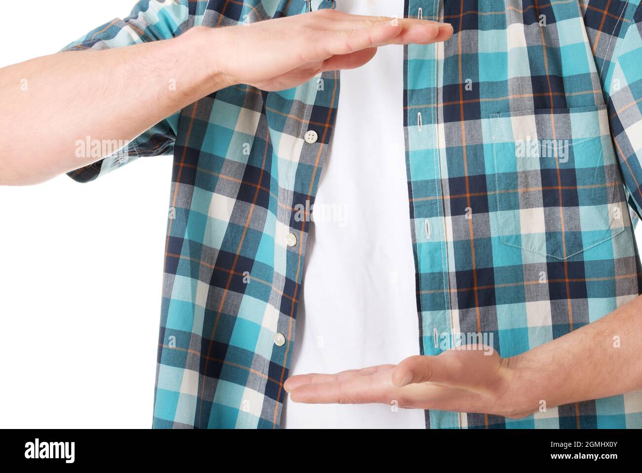 A man holding his two hands as if holding an object Stock Photo - Alamy