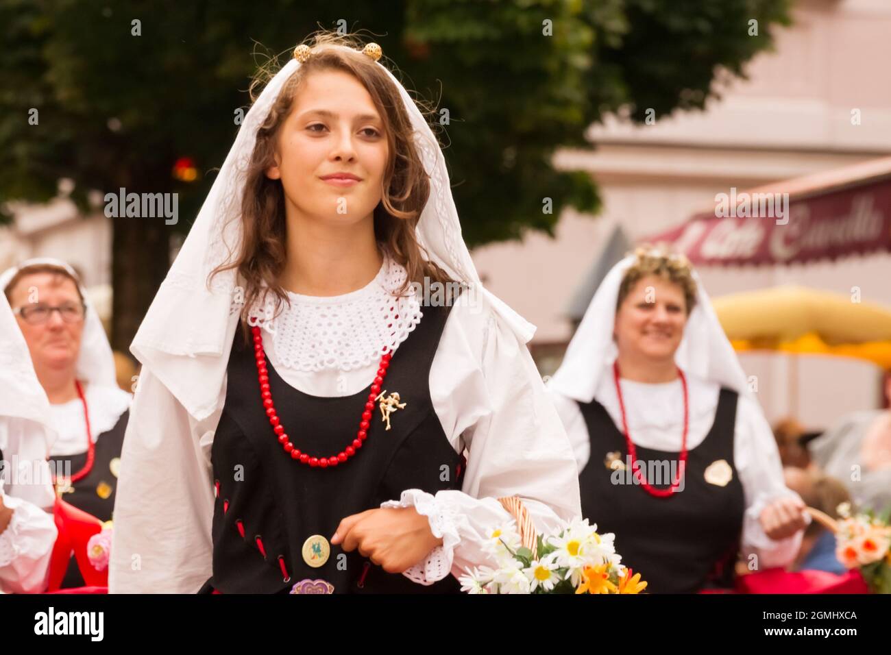 VILLACH, AUSTRIA - AUGUST 2, 2014: A beautiful lady wearing traditional ...
