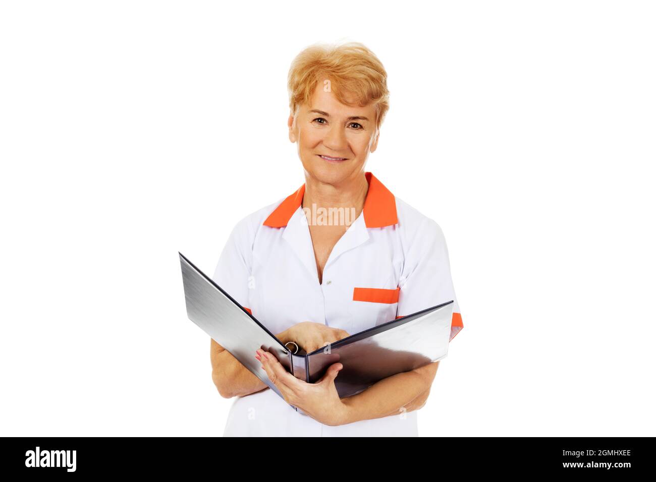 A senior female doctor wearing a white and orange uniform isolated on a ...