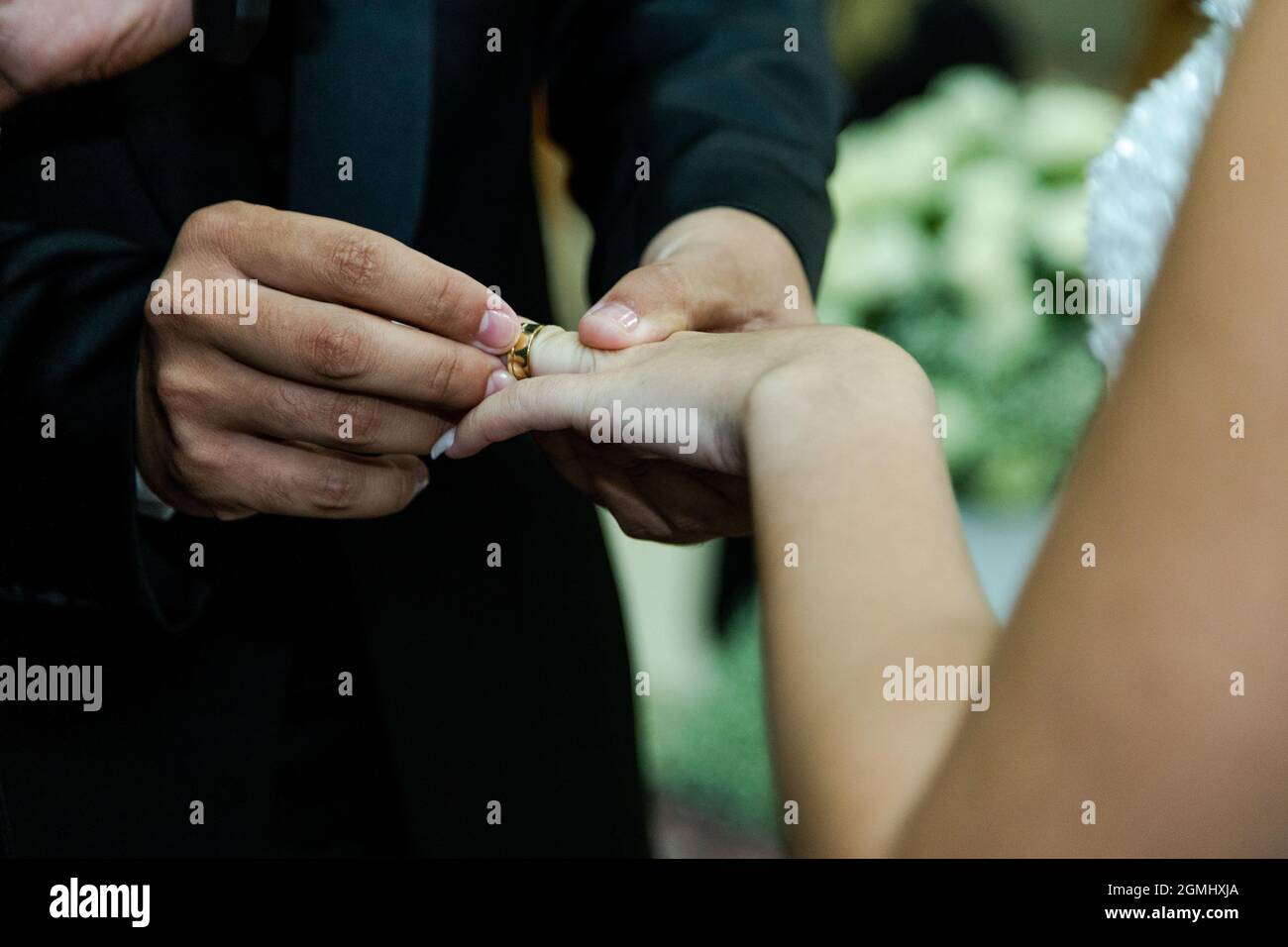 Shot groom putting ring hi-res stock photography and images - Alamy