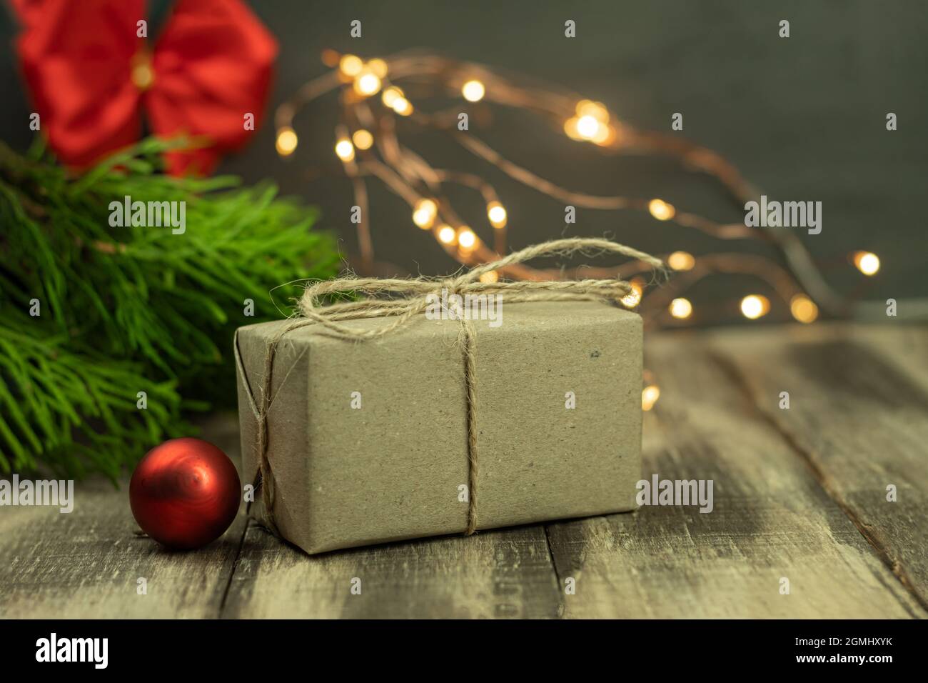 A Christmas gift wrapped in eco paper. Eco-friendly gift wrapping in ...