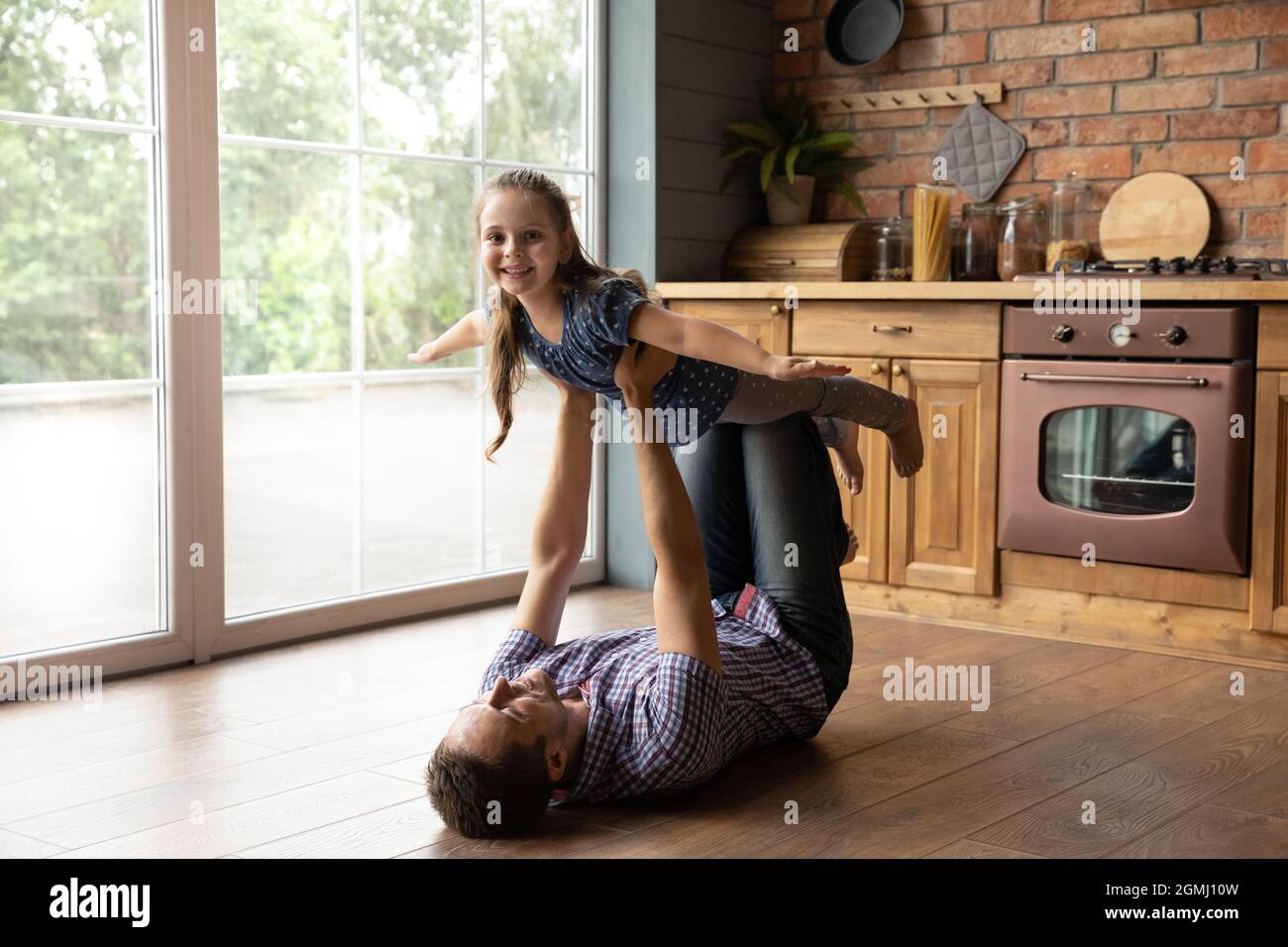 Father is lifting daughter in the air hi-res stock photography and ...
