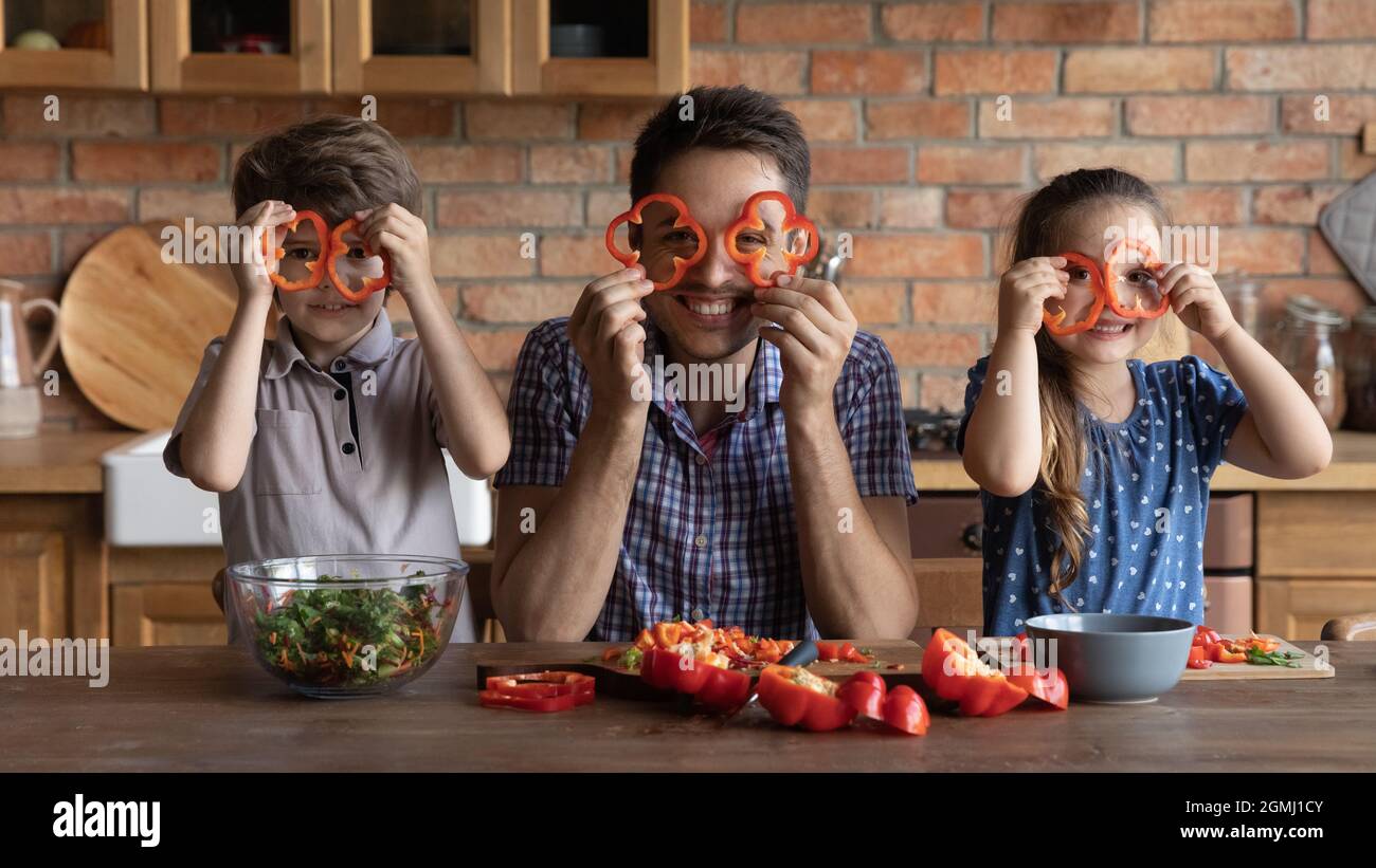 Father and children cooking dinner hi-res stock photography and images ...