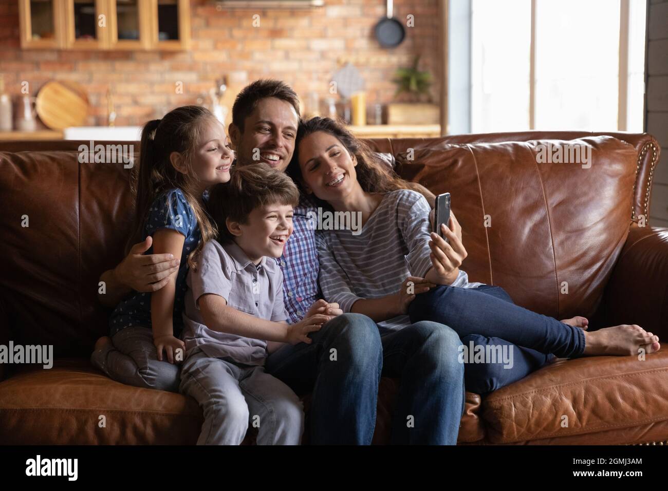 Happy bonding couple recording video on cellphone Stock Photo - Alamy