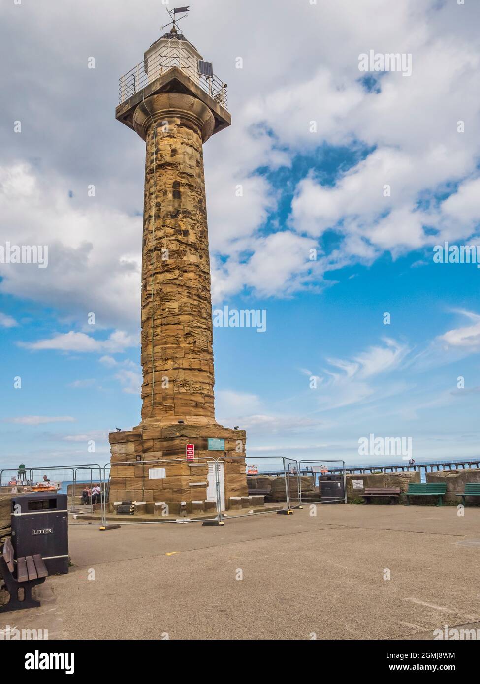 Scenic Whitby with one of the two lighthouses at the head of the jetty ...
