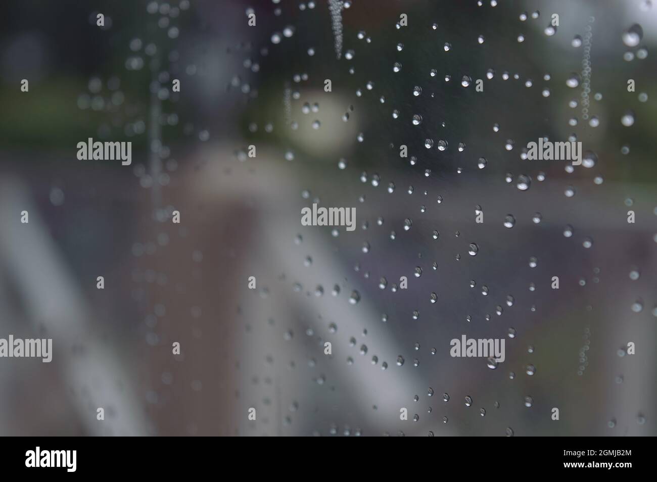 rain drops during raining in rainy day outside window glass with ...