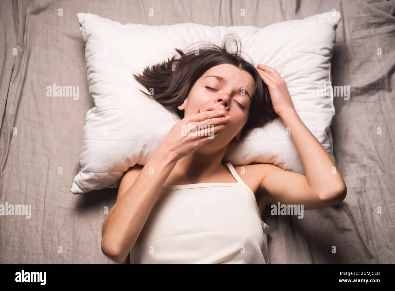 A young girl woke up in the morning in bed Stock Photo - Alamy