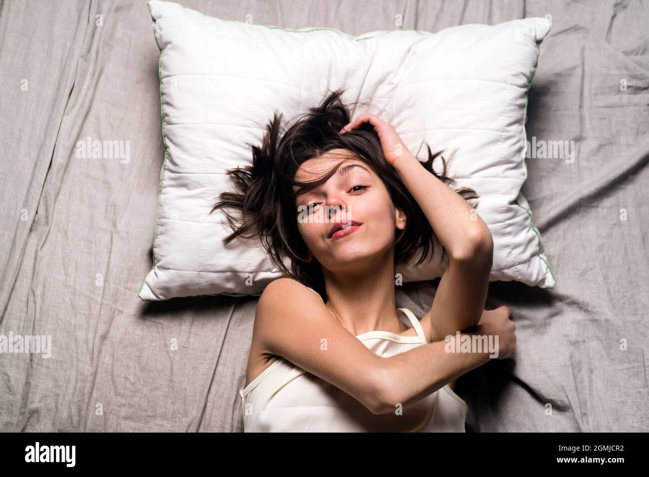 Young cute girl just woke up in her cozy bed Stock Photo - Alamy